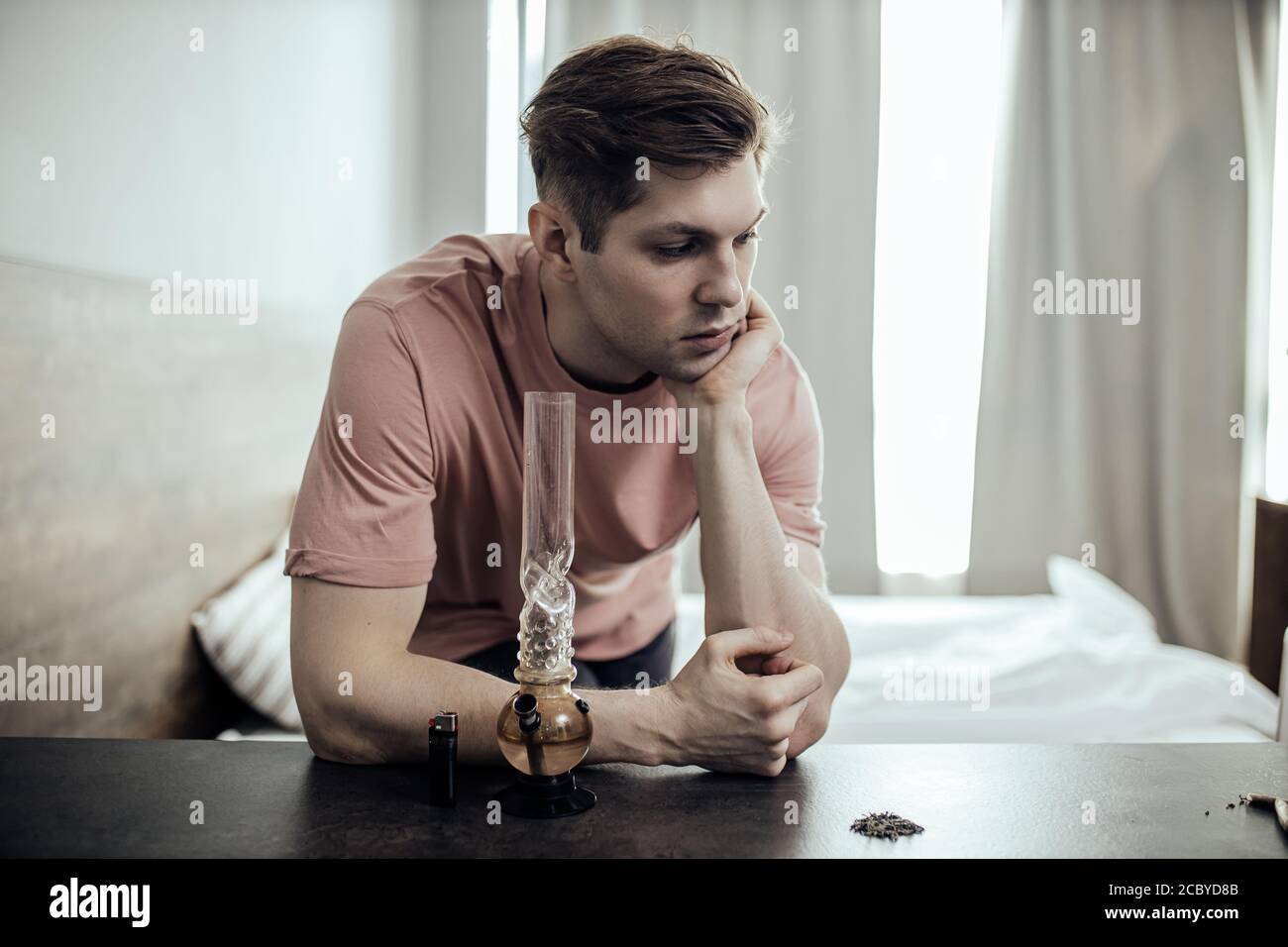 Man holding cigarette green grass hi-res stock photography and images ...