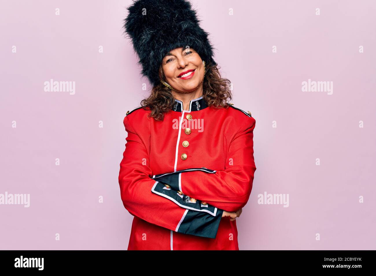 Middle age beautiful wales guard woman wearing traditional uniform over ...