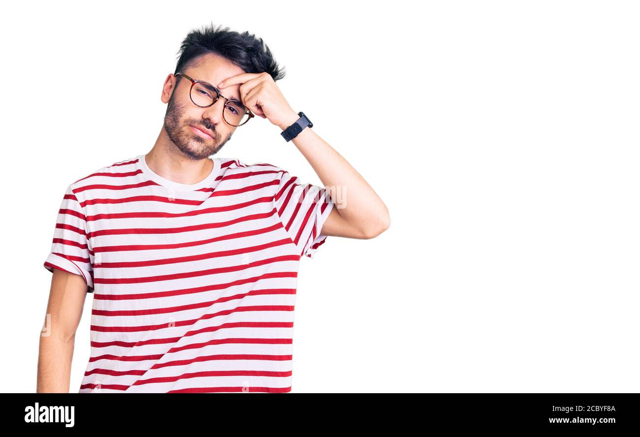 Young hispanic man wearing casual clothes pointing unhappy to pimple on ...