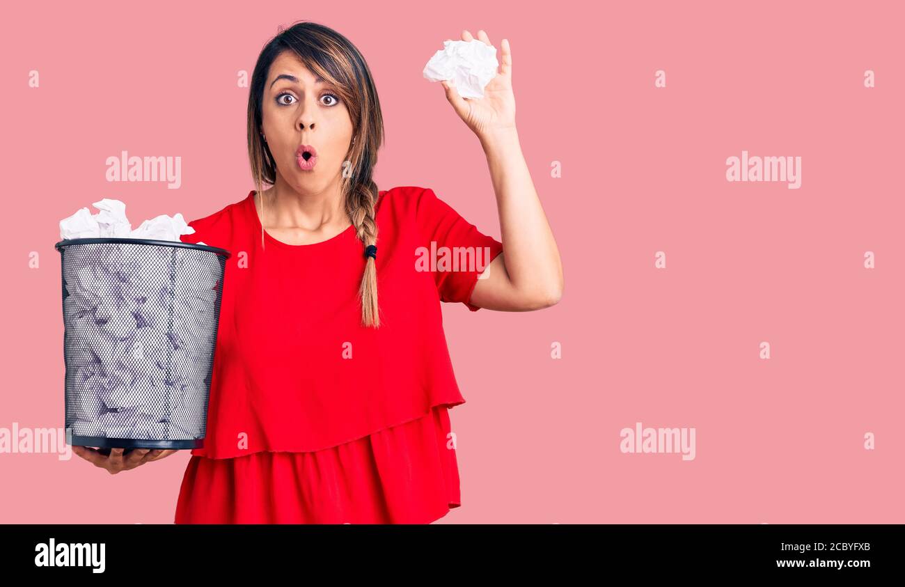 Woman holding papers shocked hi-res stock photography and images - Alamy