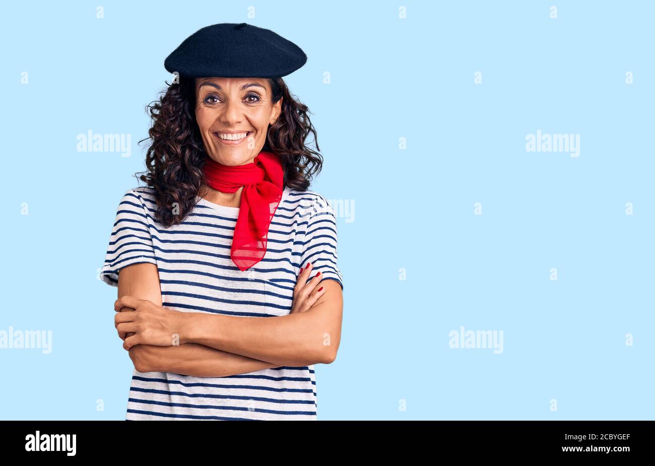 Middle age beautiful woman wearing french beret and scarf happy face ...