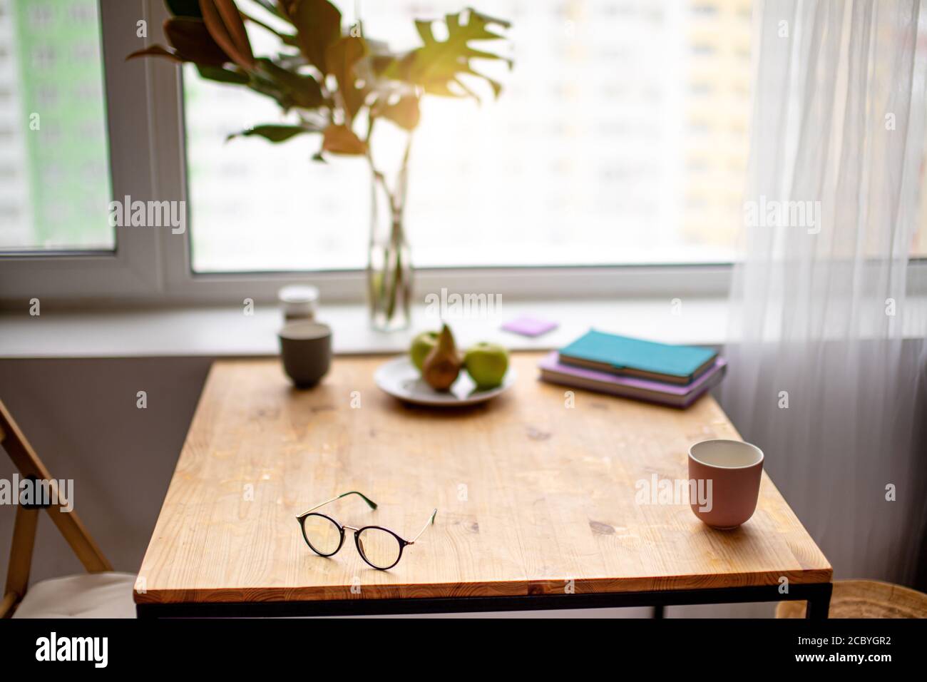 empty modern kitchen table without food. family members work at this ...