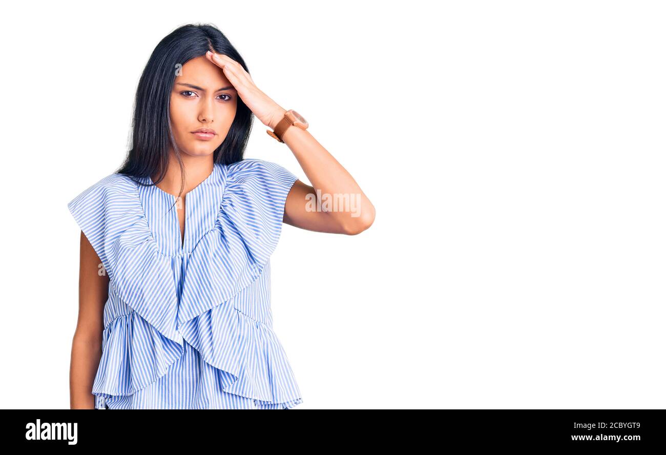 Young beautiful latin girl wearing casual clothes worried and stressed ...