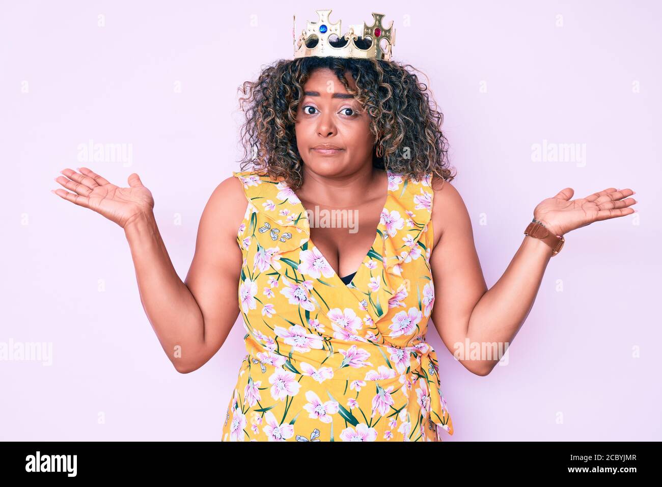 Young african american plus size woman wearing princess crown clueless ...