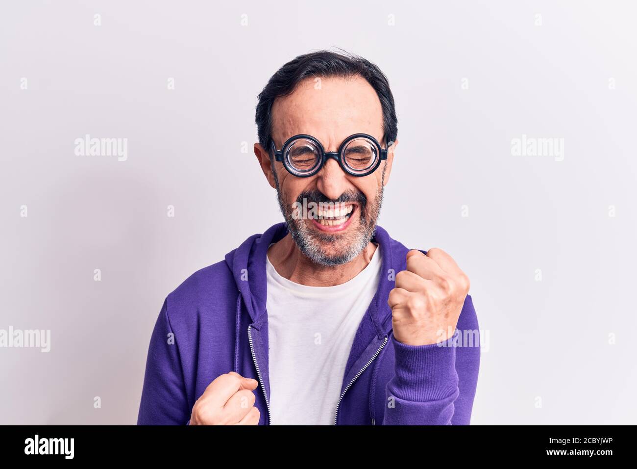 Middle age handsome freaky man wearing dumb glasses over isolated white ...