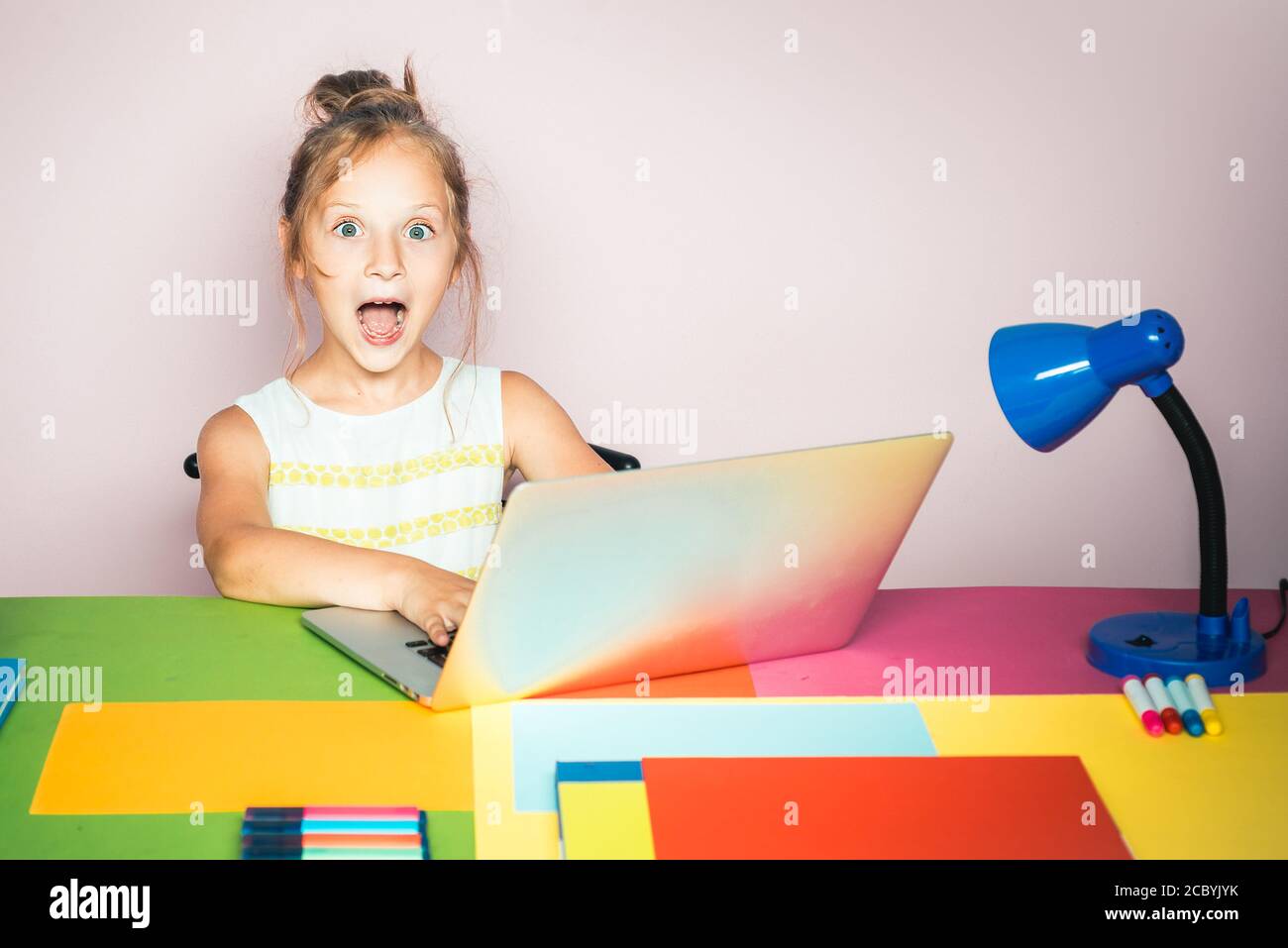Excited child girl in home school. Elementary school learning and kids ...