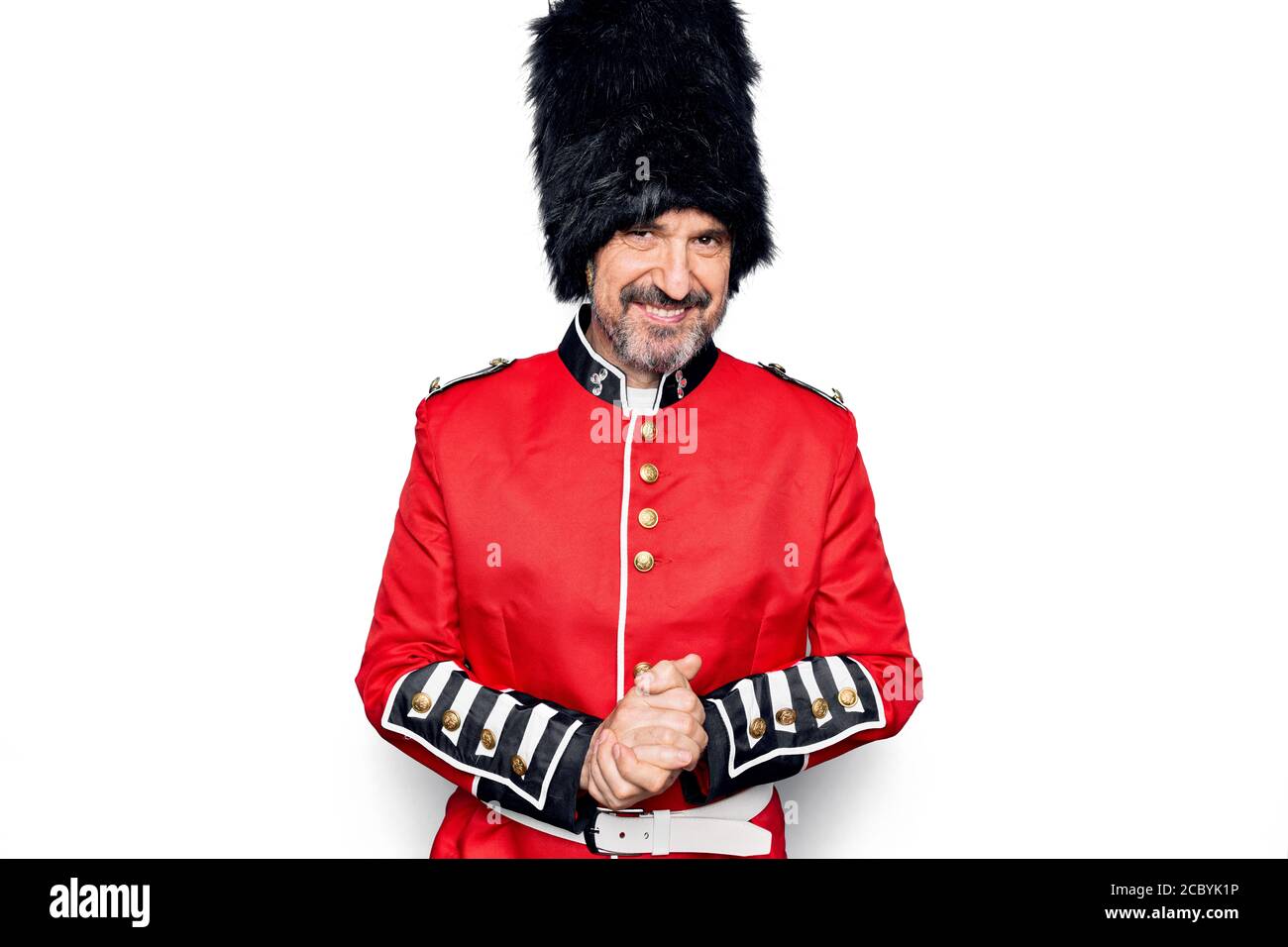 Middle age handsome wales guard man wearing traditional uniform over ...