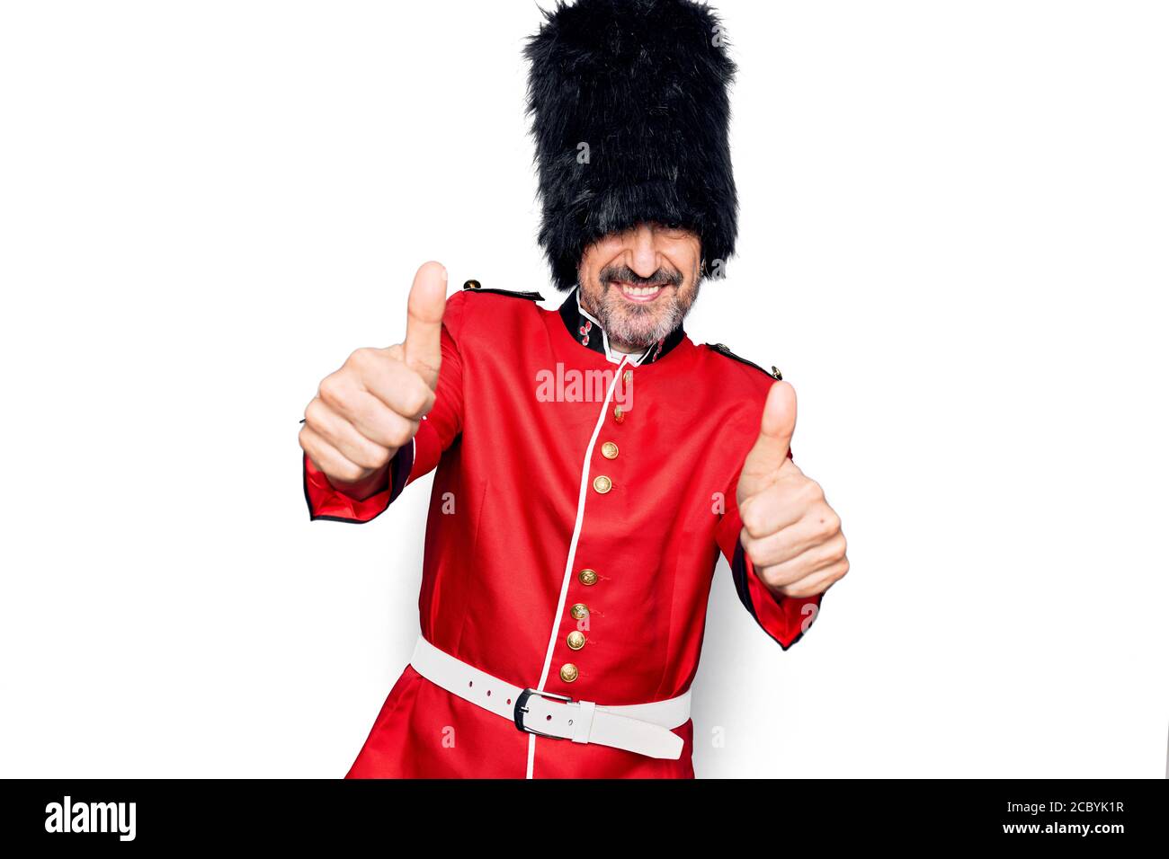Middle age handsome wales guard man wearing traditional uniform over ...