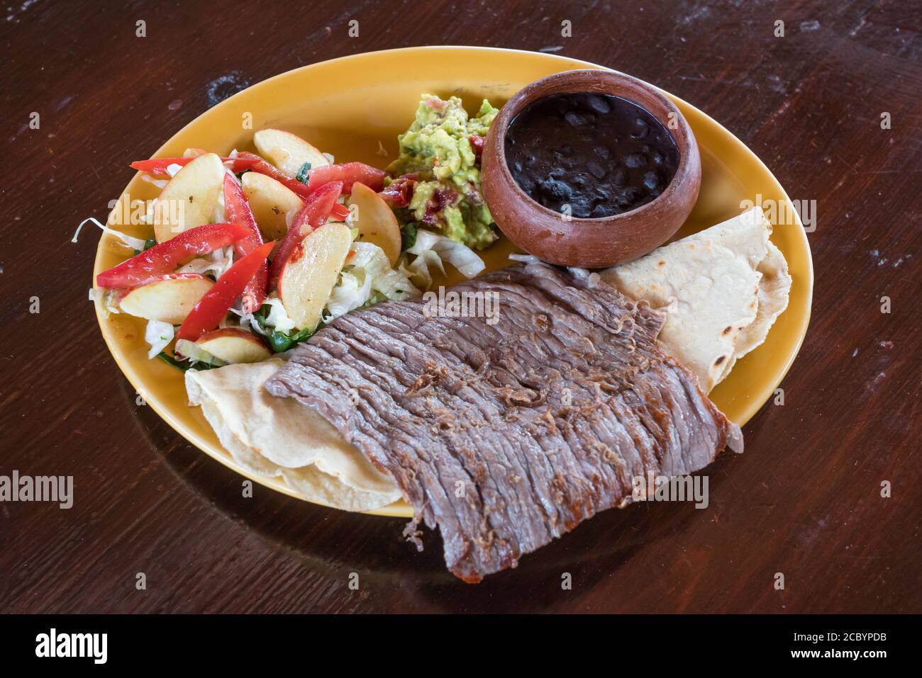 Tasajo is thinly sliced grilled beef tenderloin, served here with a ...