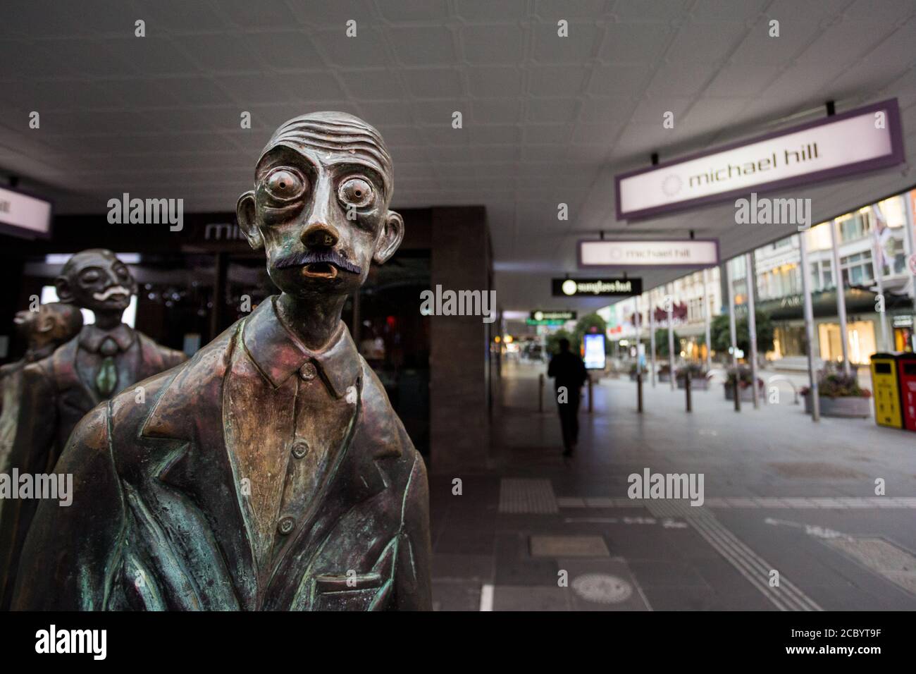A startled looking street statue witnesses the city devoid of human ...