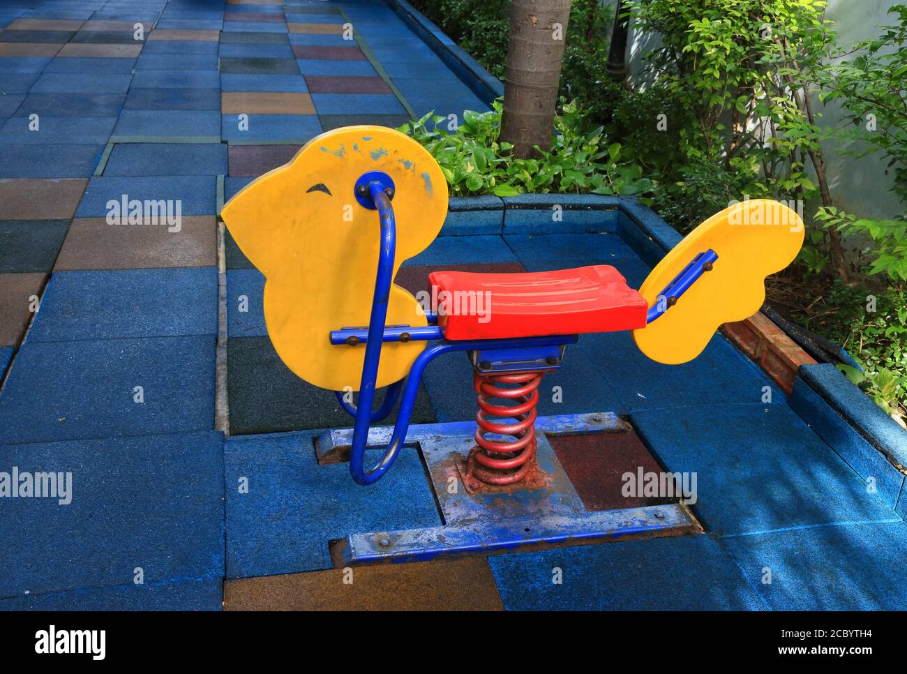 Closeup empty spring rider installed in playground Stock Photo - Alamy