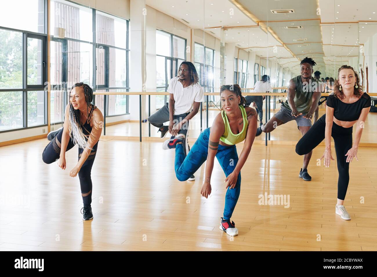 Dance coach showing new movement Stock Photo - Alamy
