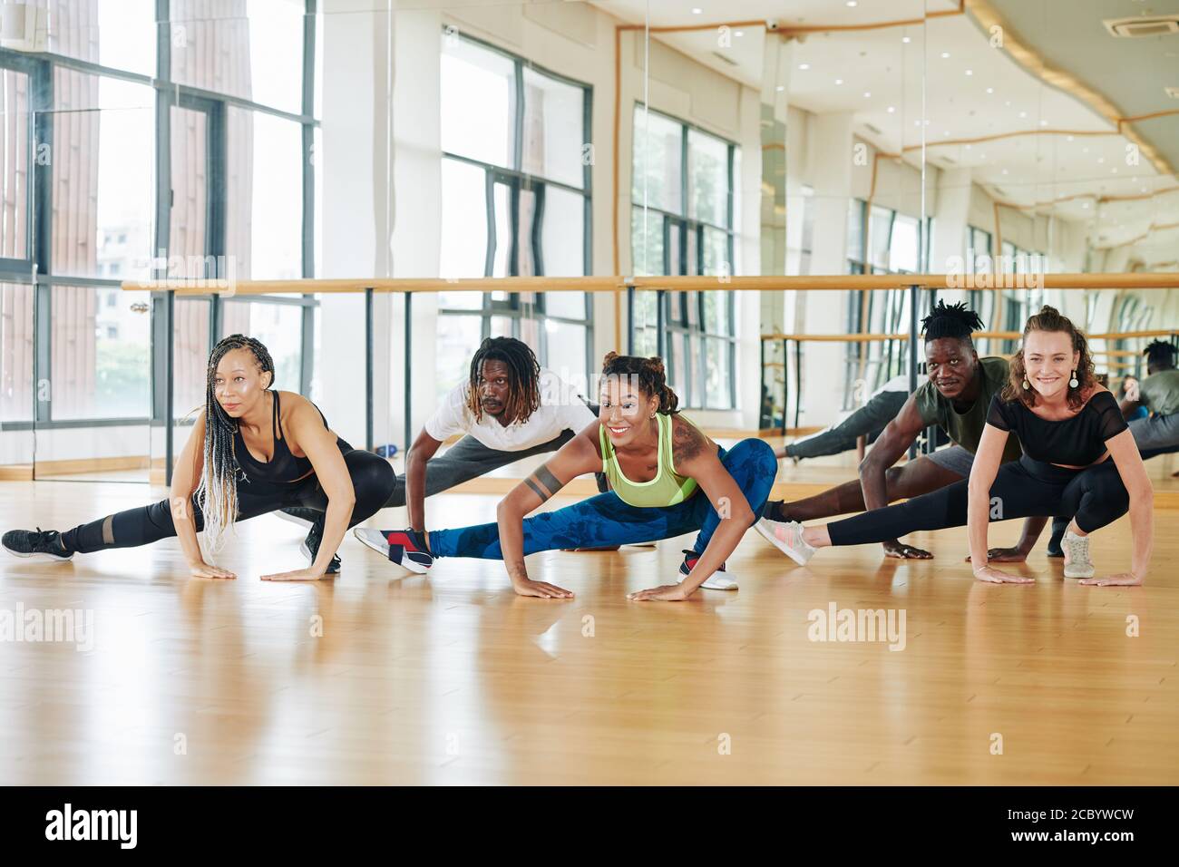 Dancers doing half squats Stock Photo - Alamy