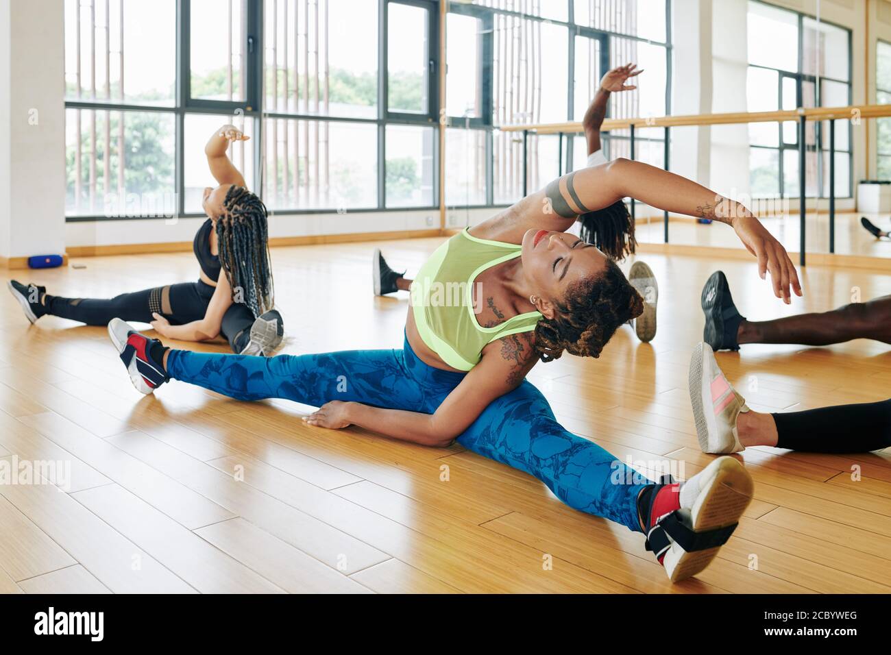 Woman doing splits at dance class Stock Photo - Alamy