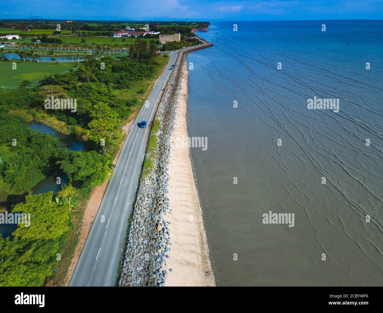 An aerial view of coastal road near town of Kuala Perlis, Malaysia ...