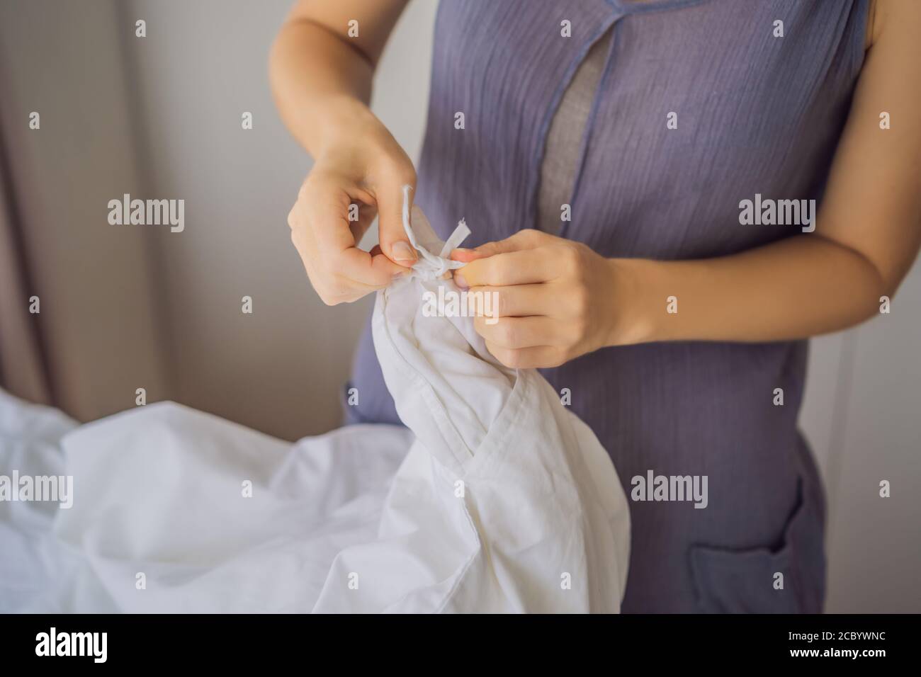 Woman changing sheets hi-res stock photography and images - Alamy