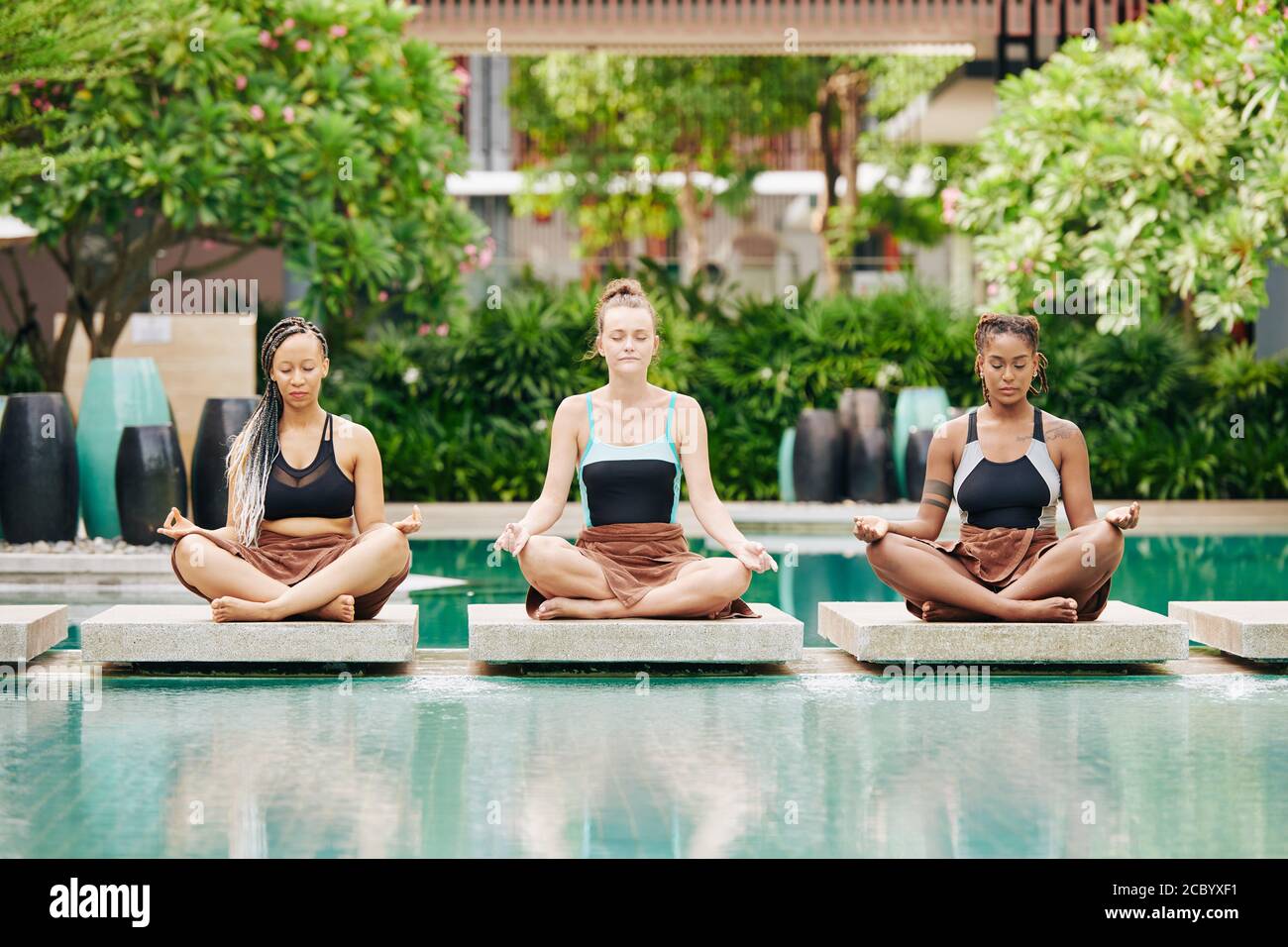 Calm women doing breathing exercise Stock Photo - Alamy