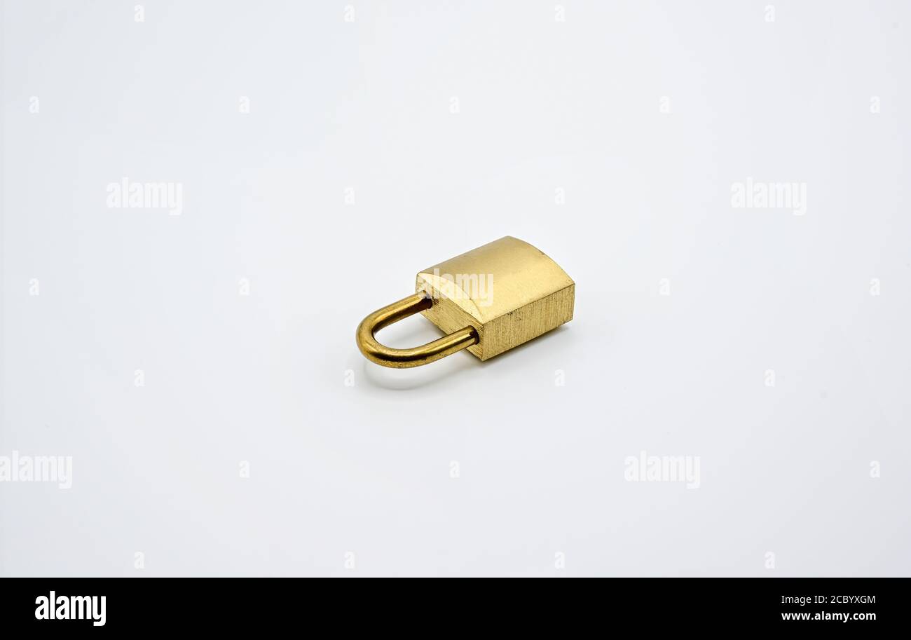 Golden padlock on a white background Stock Photo - Alamy