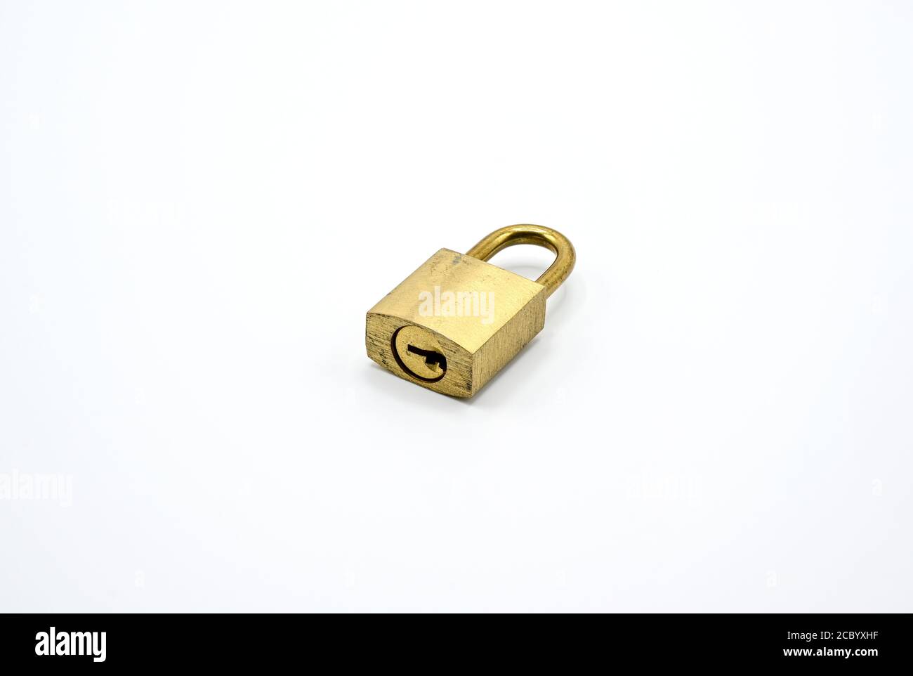Golden padlock on a white background Stock Photo - Alamy