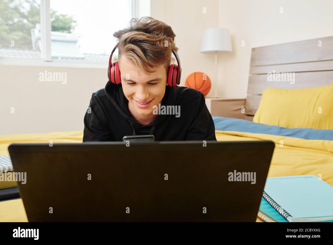 Boy headphones texting hi-res stock photography and images - Alamy