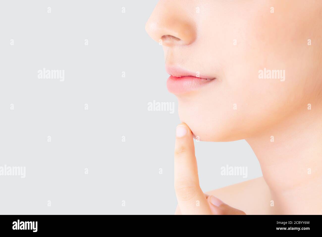 Closeup beautiful woman asian makeup of cosmetic, girl hand touch chin ...