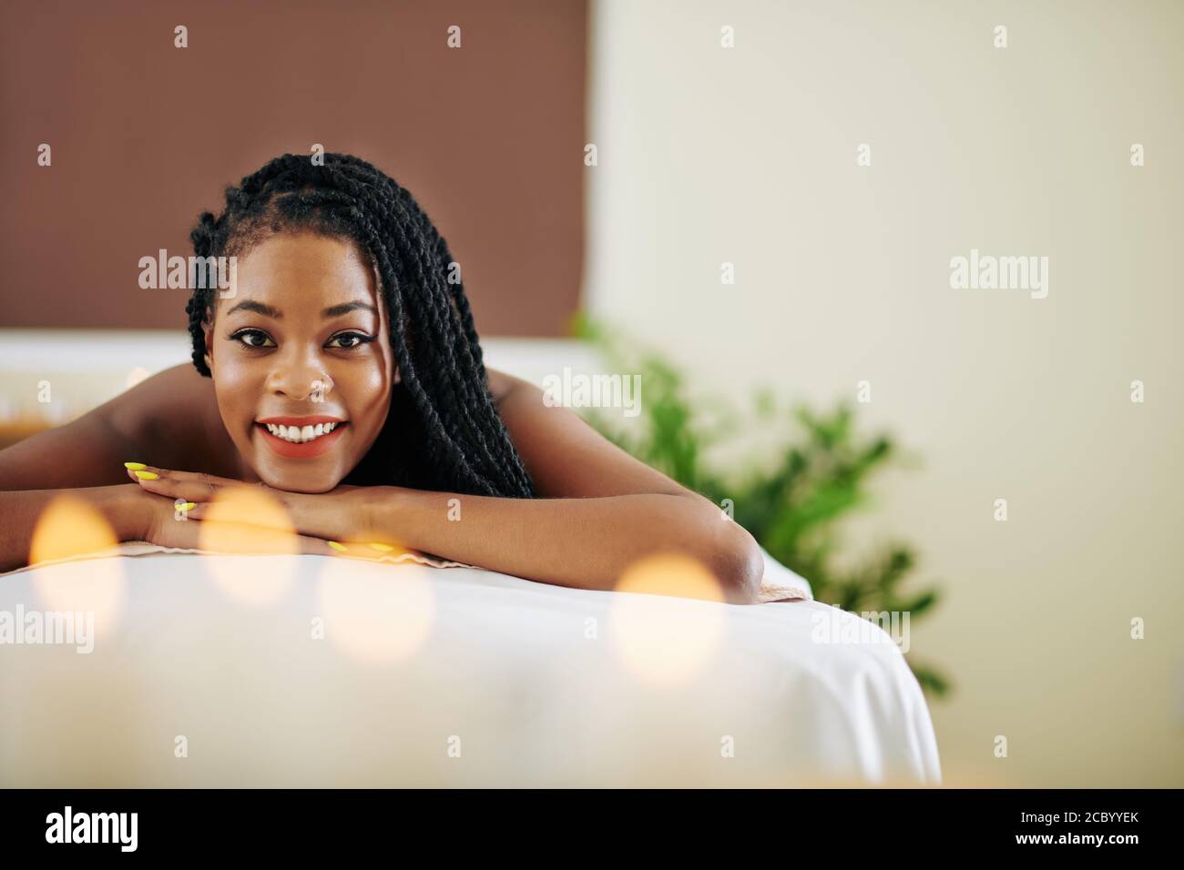 Happy woman in spa salon Stock Photo - Alamy
