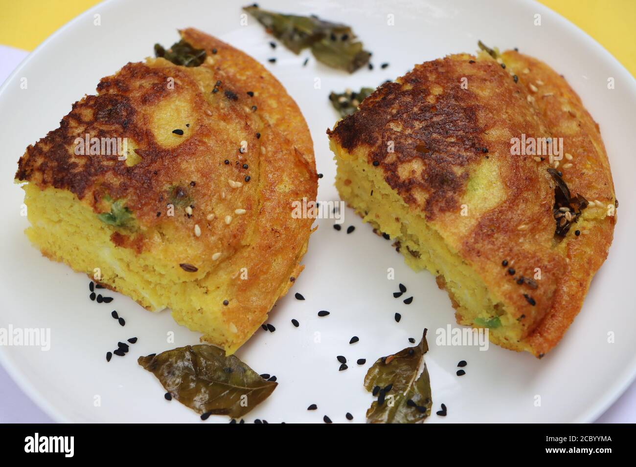 Handwa or Handvo - Gujarati snack cake with rice, lentil and spices ...