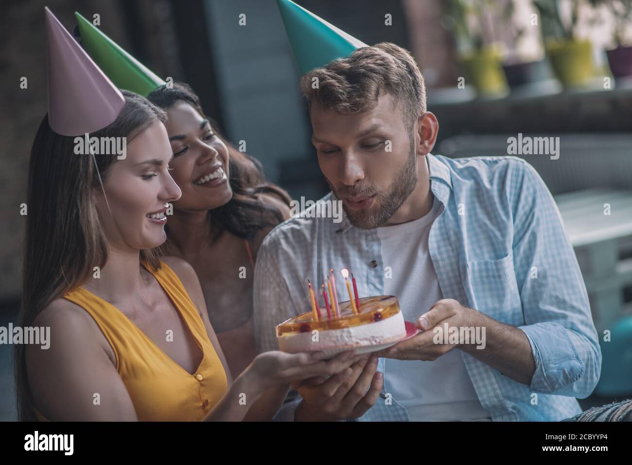 Joyful man holding his birthday cake at the party Stock Photo - Alamy