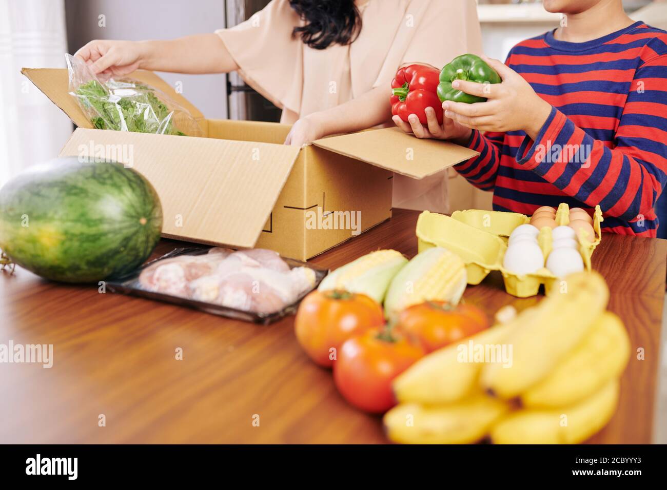 Unpacking box of groceries Stock Photo - Alamy