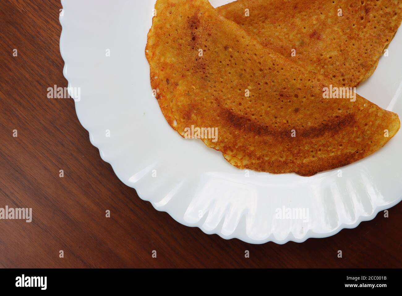Adai dosa, lentil dosa, a crisp, golden dosa made using a batter of ...
