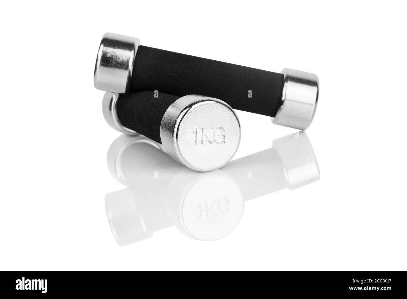 Two 1 kg dumbbells white background & reflection isolated close up ...
