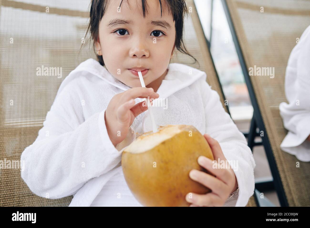 Girl with coconut hi-res stock photography and images - Alamy
