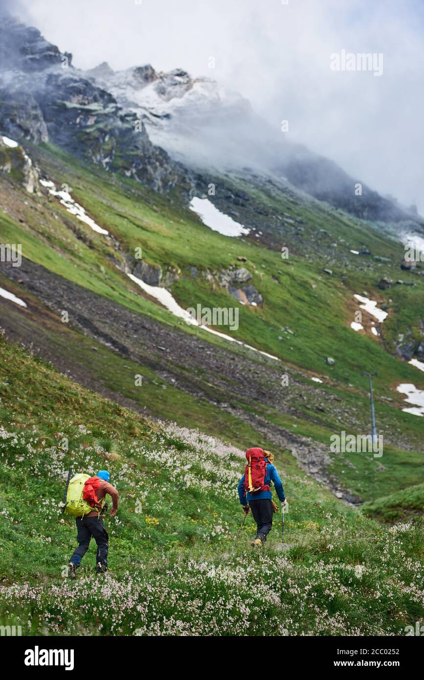 People walking down rocky path hi-res stock photography and images - Alamy