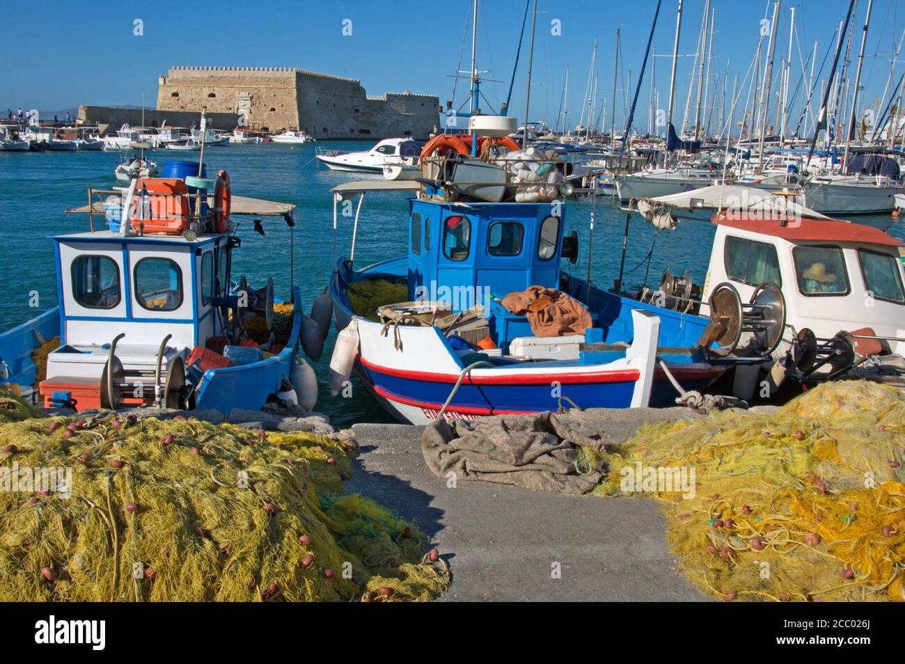 Scenic fishermen' boats and nets in the inner harbor of Heraklion at ...