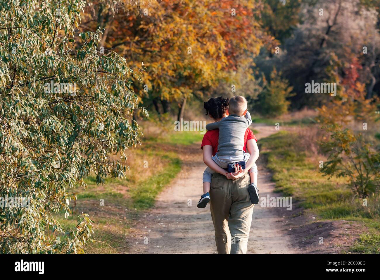 Child on moms shoulders hi-res stock photography and images - Alamy