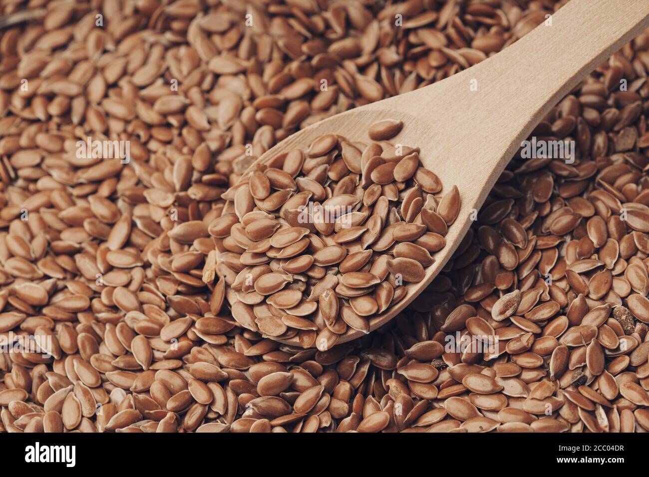 Flax seeds linseed on wooden spoon. Healthy food for preventing heart ...