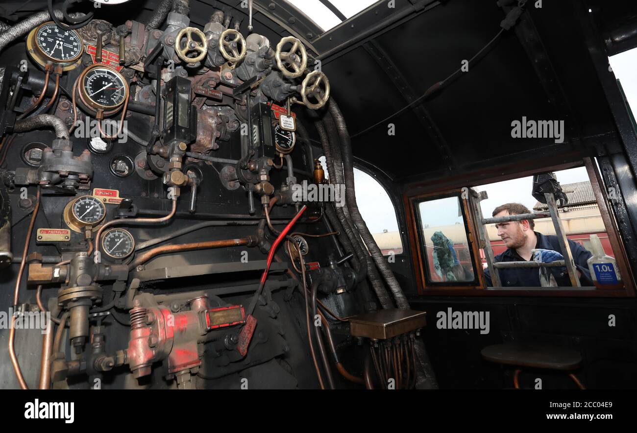Wansford, UK. 15th Aug, 2020. Jamie Bond cleans the train to make it ...