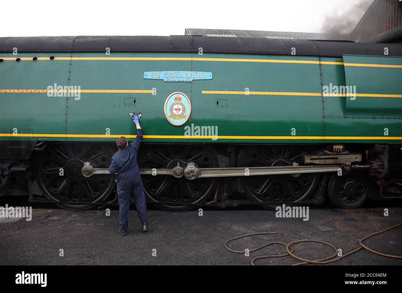 Wansford, UK. 15th Aug, 2020. Jamie Bond cleans the locomotive to make ...