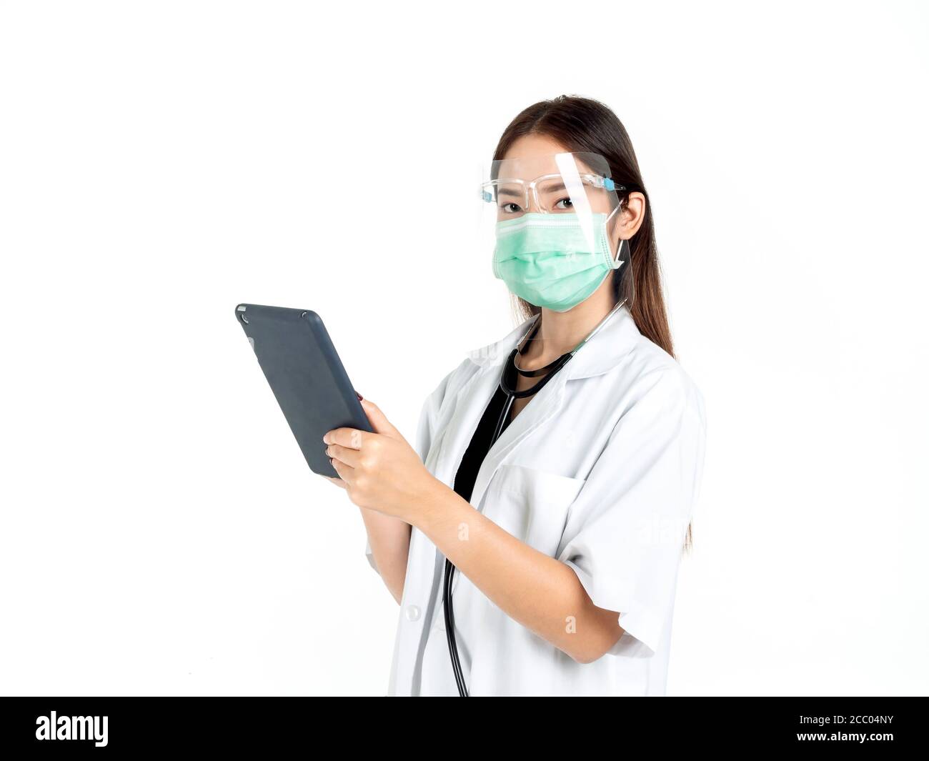 Asian woman doctor wearing green medical face mask, face shield and ...