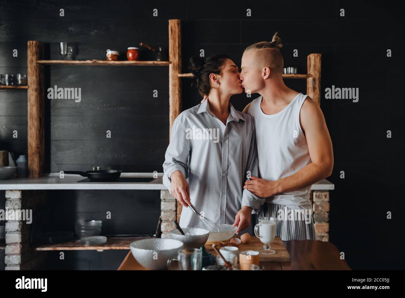 Young couple in love cook healthy food in the kitchen together. While ...