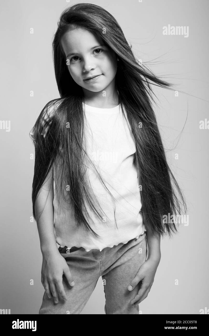 Beautiful child. Little girl in black and white studio Stock Photo - Alamy