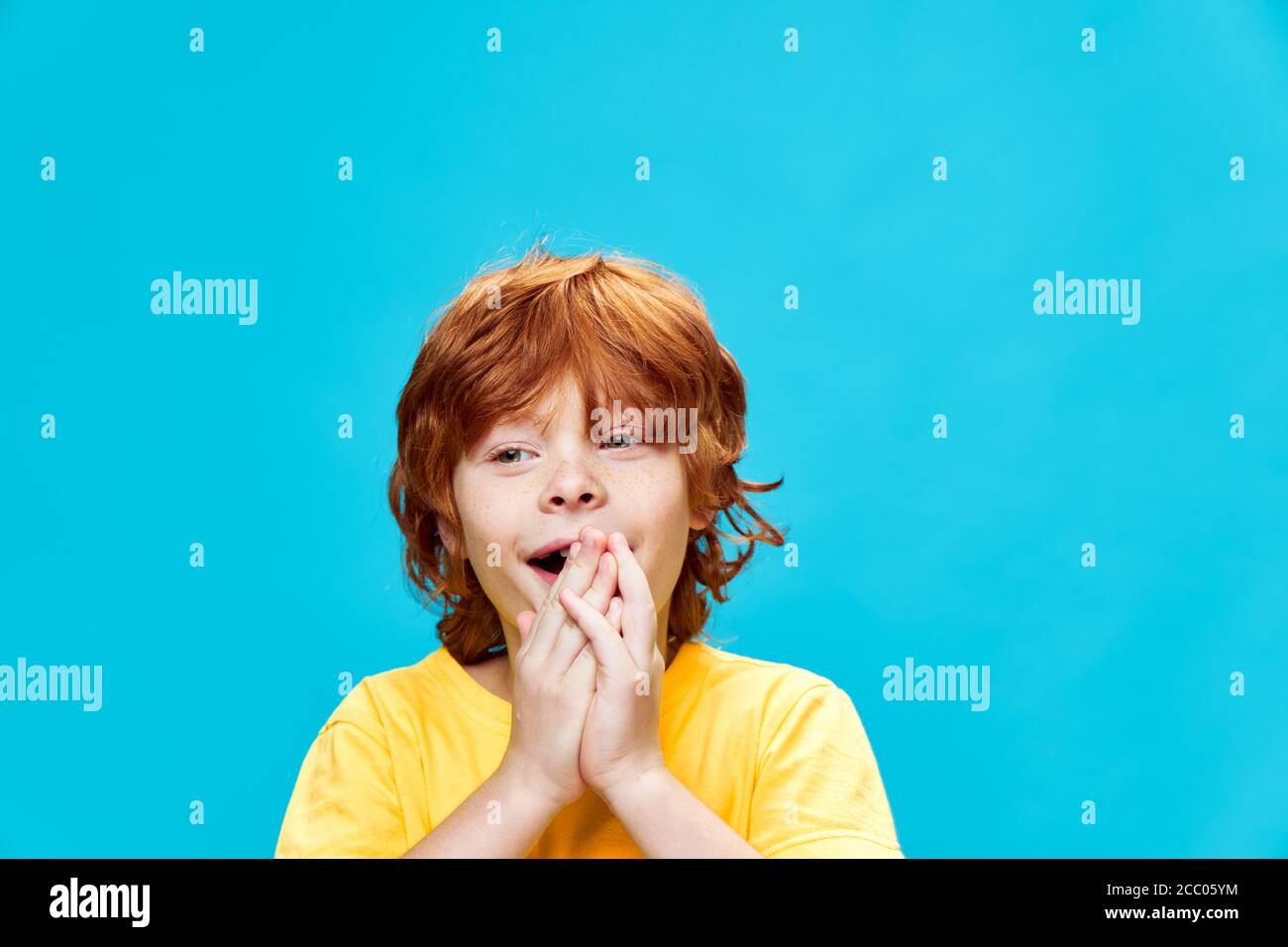 Happy child touching face with hands close-up cropped view Stock Photo ...