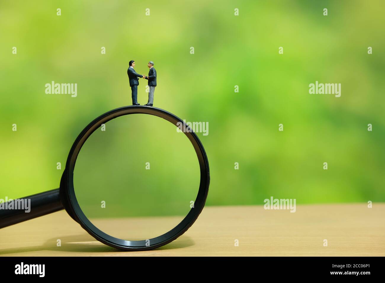 Business strategy conceptual photo - Two miniature businessman make ...