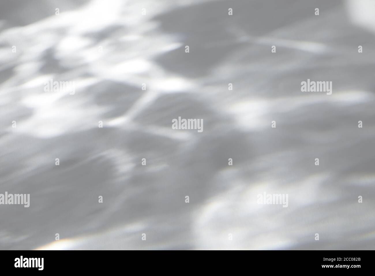 shadow and light caustic effect on a white wall Stock Photo - Alamy