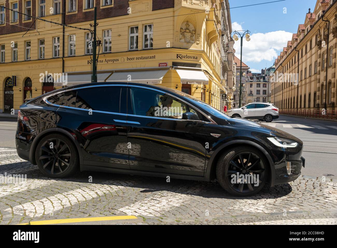 Tesla Model X while driving through the streets of Prague Stock Photo ...