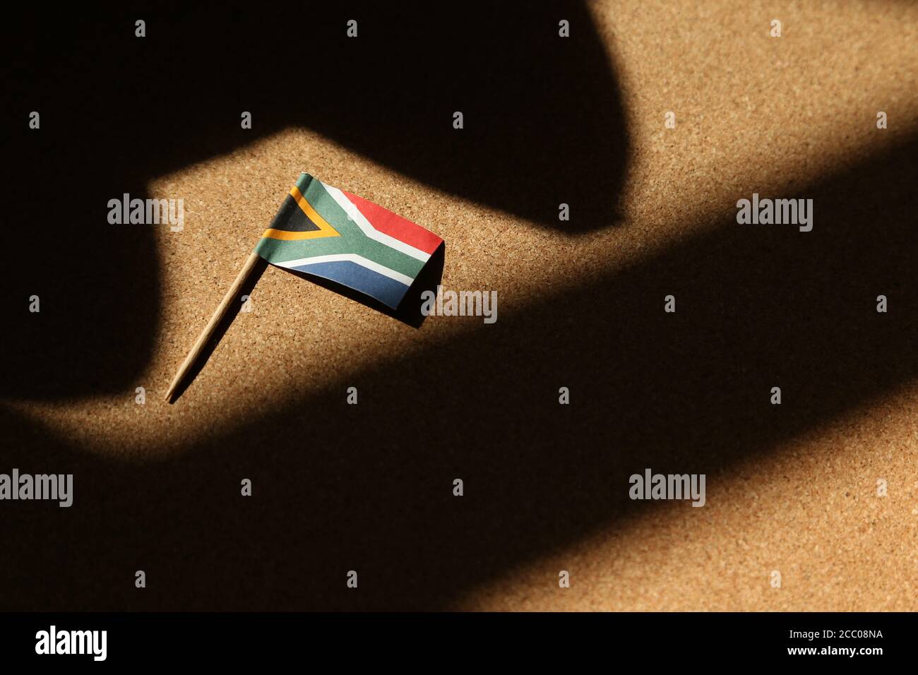 A South African flag surrounded by shadows Stock Photo - Alamy