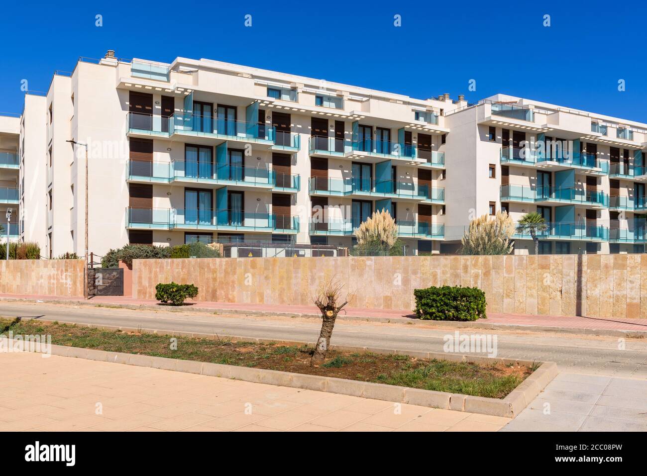 Traditional Spanish architecture, modern hotels on seaside promenade in ...