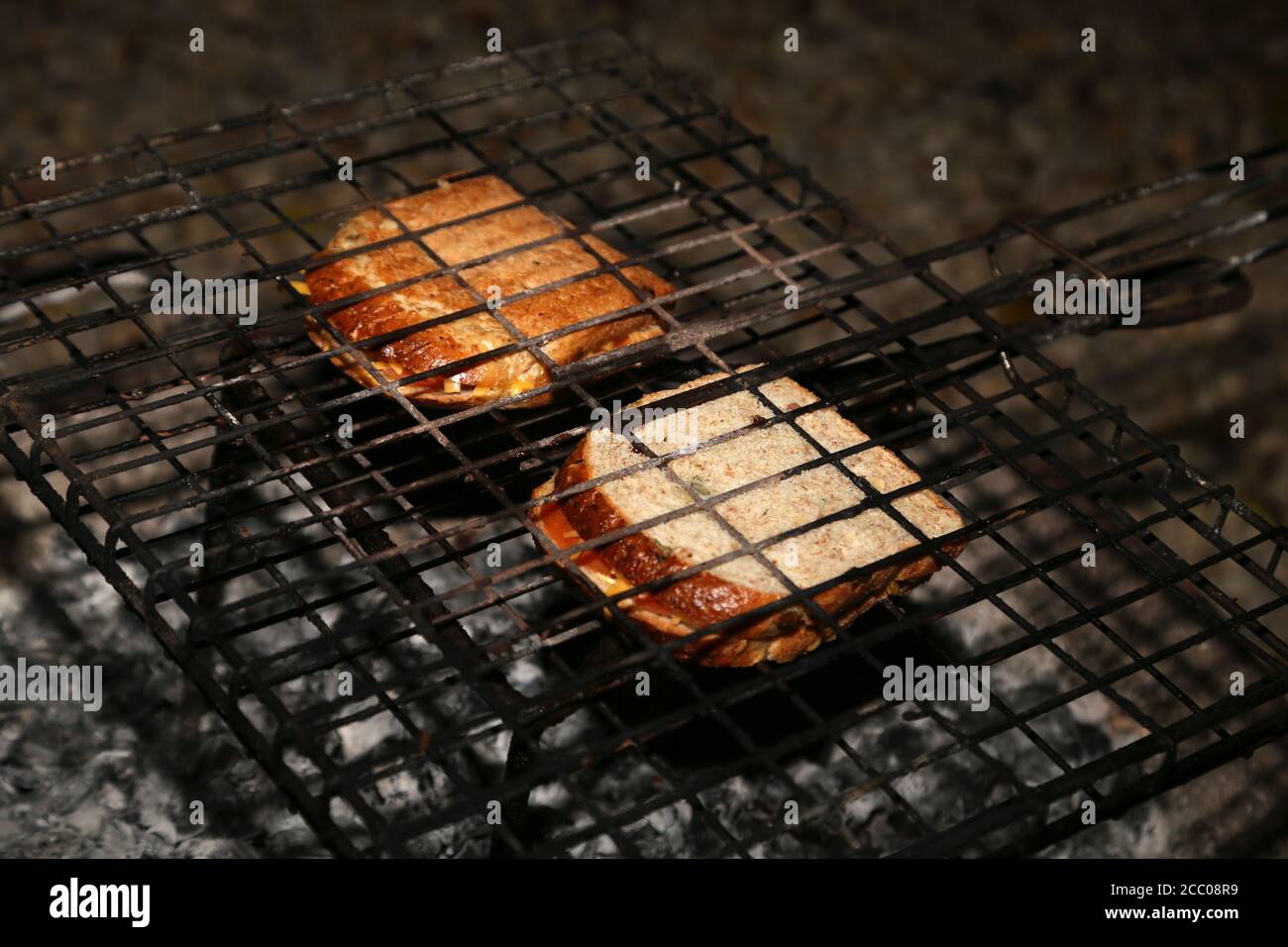 Delicious sandwiches being grilled on the fire Stock Photo - Alamy