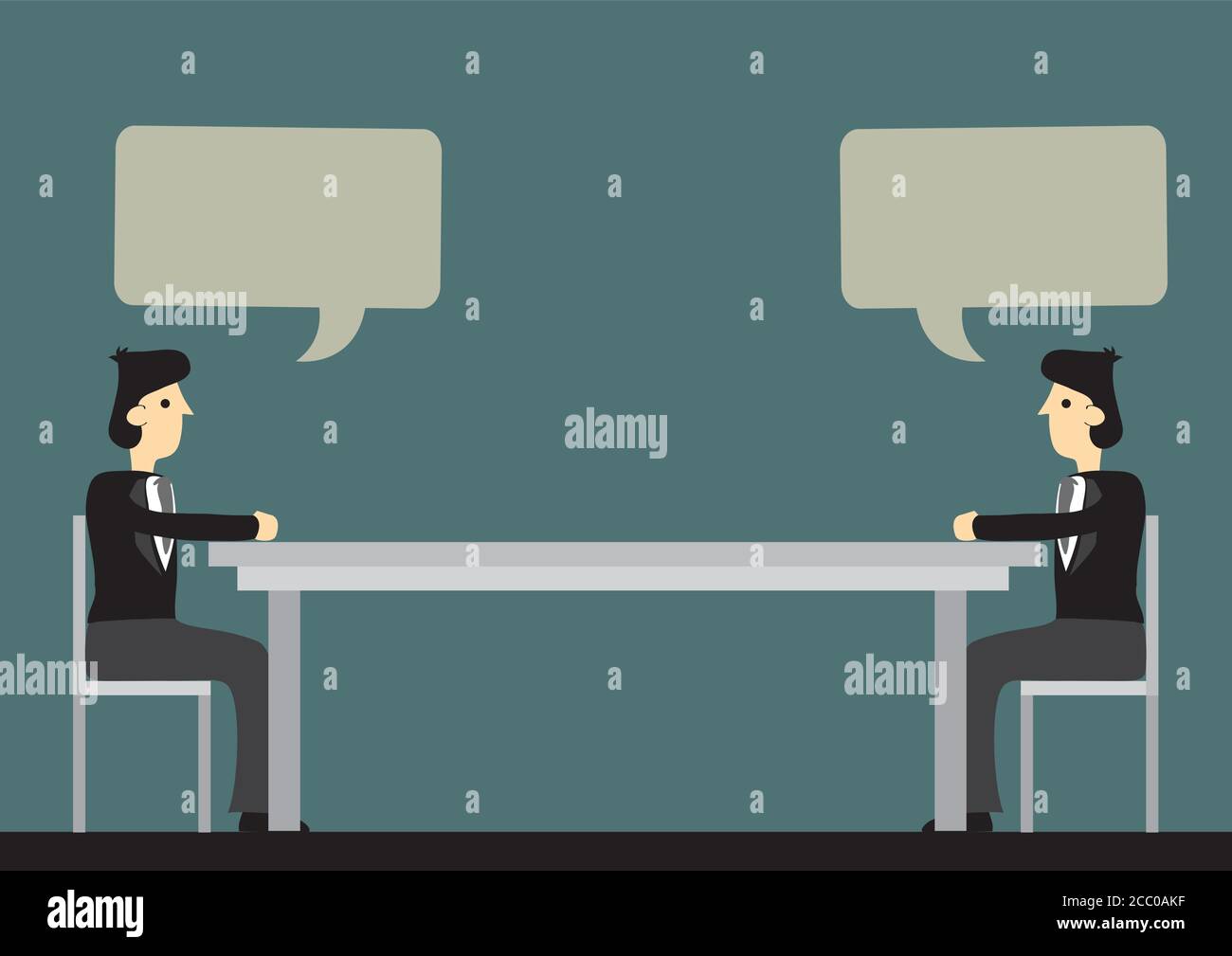 Two businessmen sitting at two ends of a long table with blank speech ...