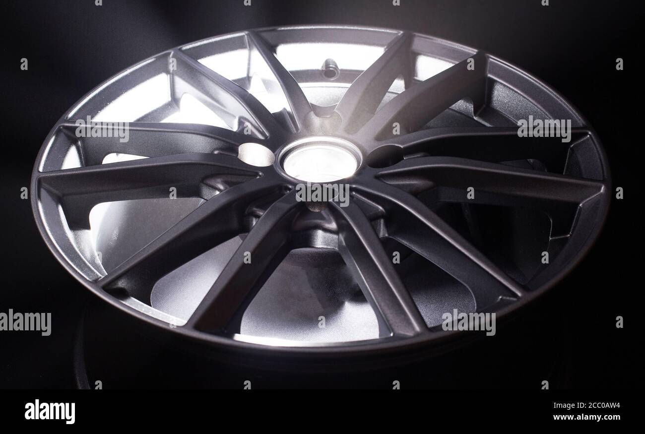 Modern beautiful car alloy wheel in the form of rays that is ...